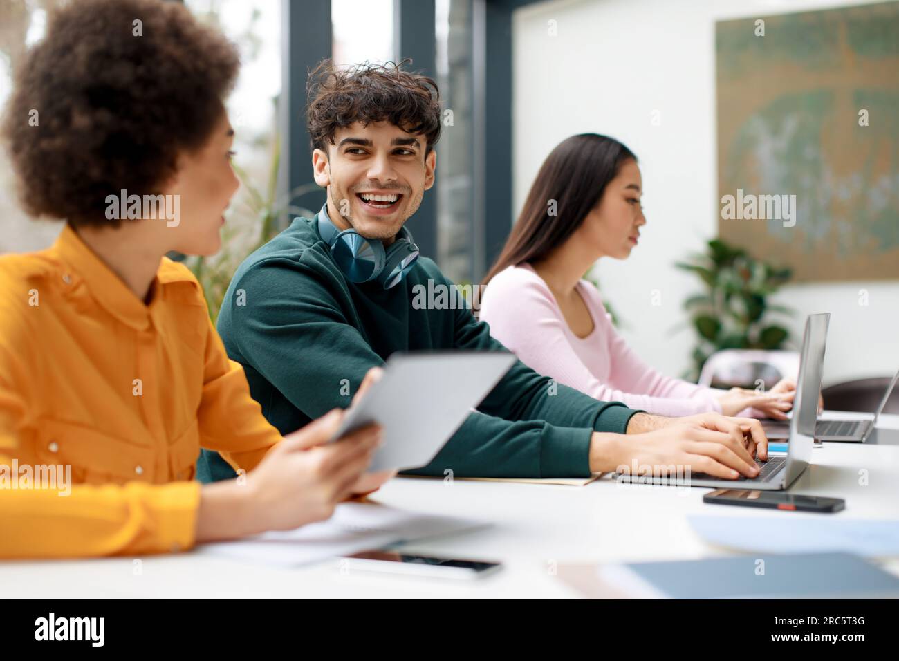 Multiethnic male students learning gadgets hi-res stock photography and ...