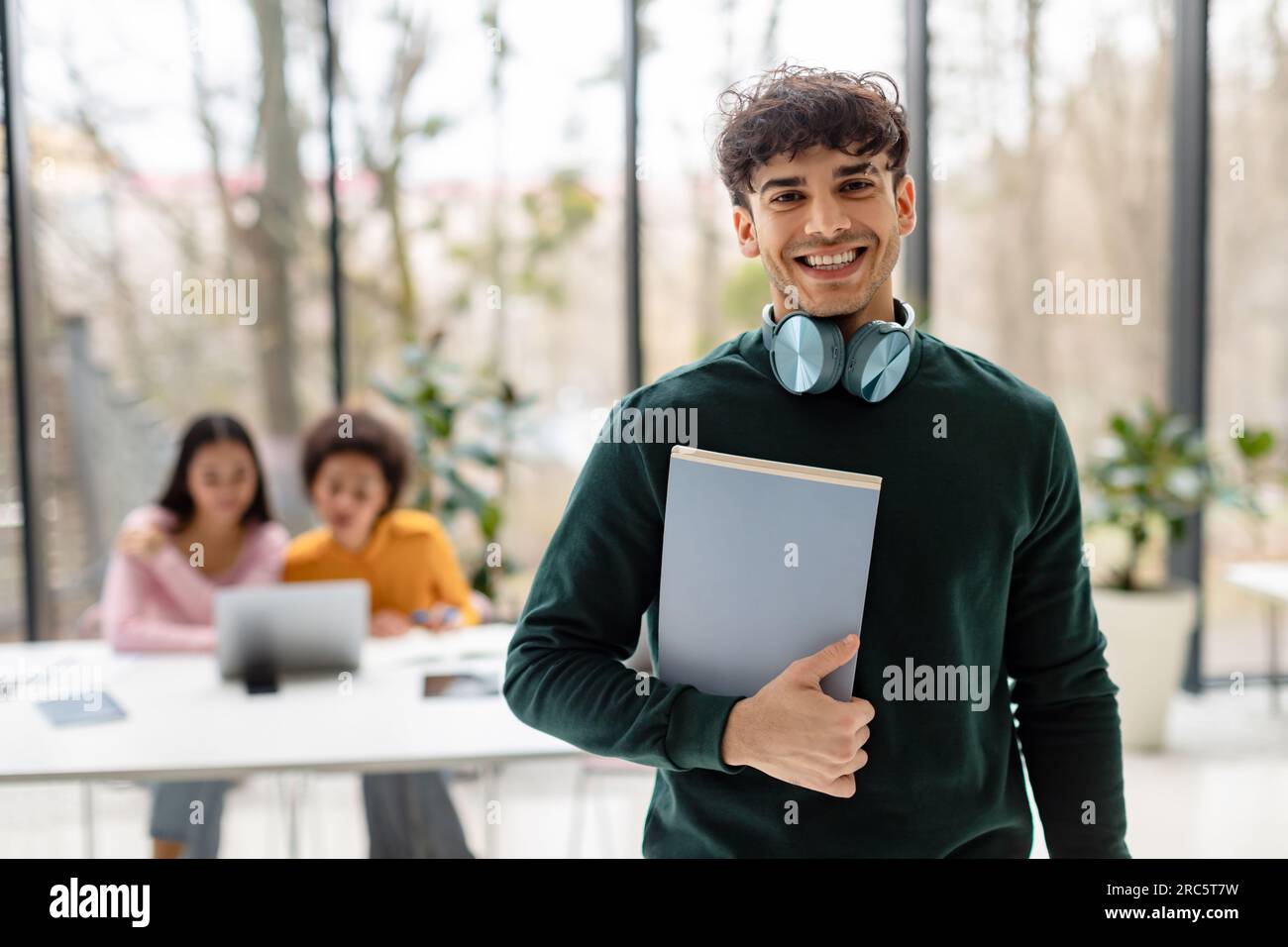 Three happy successful classmates hi-res stock photography and images ...