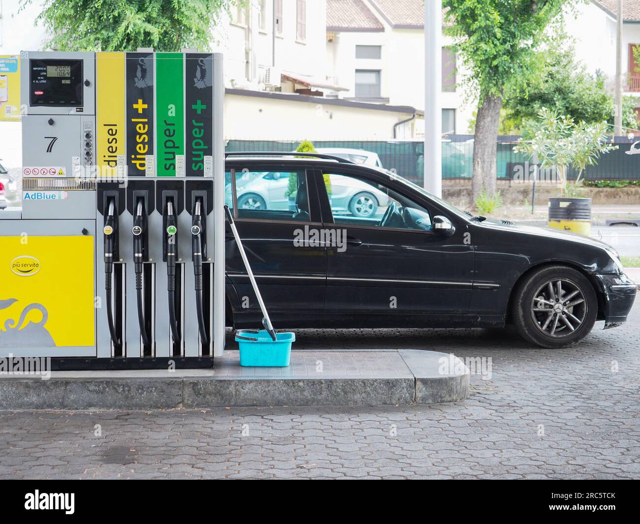 Cremona, Italy - July 3 2023 Customer self service refilling car at eni ...