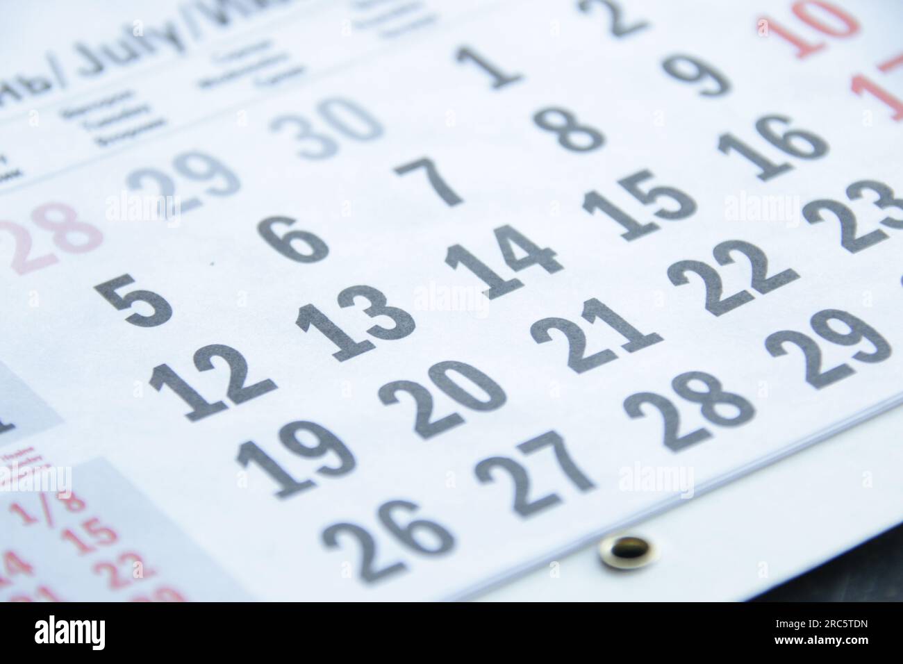 Calendar page with black and red numbers Stock Photo - Alamy