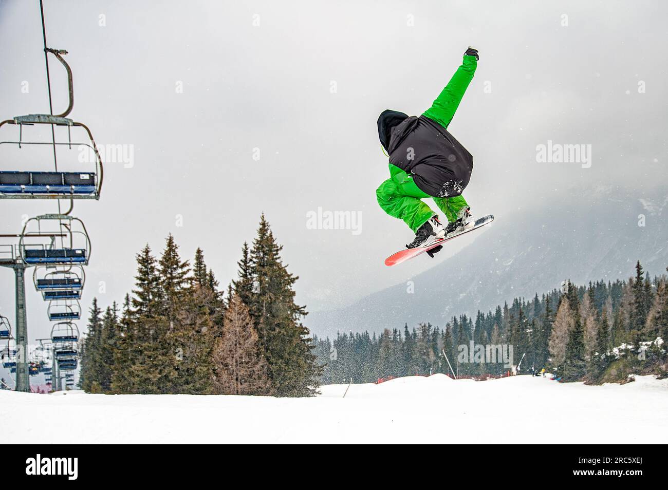Snowboarder on a slope in the alps Stock Photo - Alamy