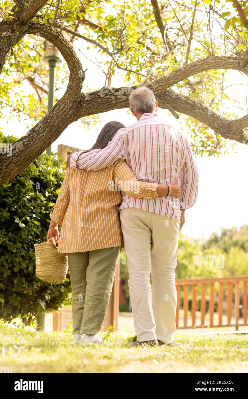 Senior european man and woman hugging, enjoys romantic date, walk in ...