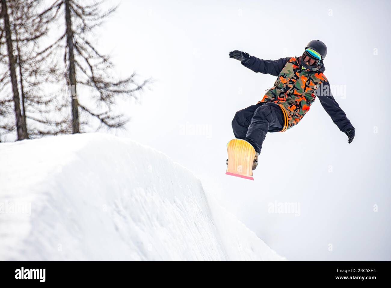 Snowboarder on a slope in the alps Stock Photo - Alamy