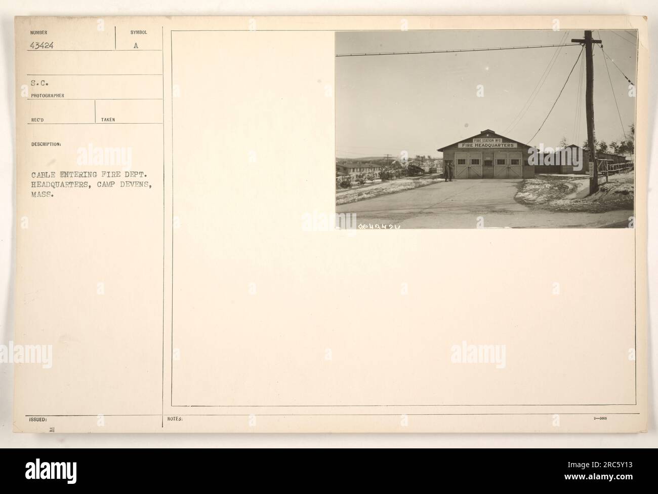 Soldiers connecting a cable to the fire department headquarters at Camp ...