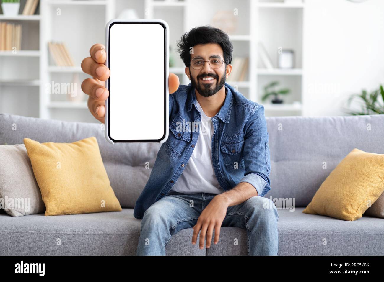 Mobile Ad. Happy Indian Man Demonstrating Blank Smartphone With Big ...