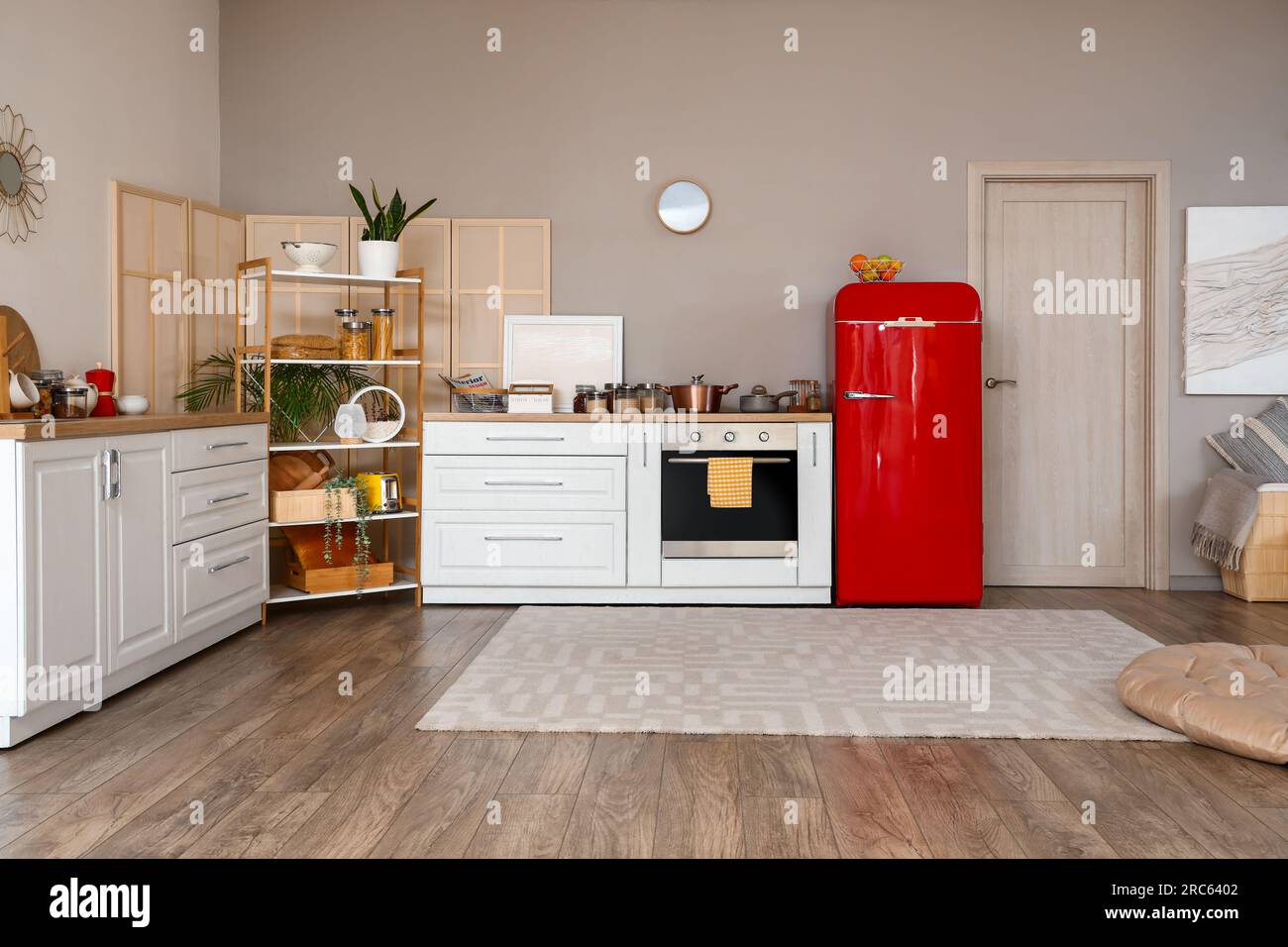 Interior of kitchen with red fridge, counters and shelving unit Stock ...