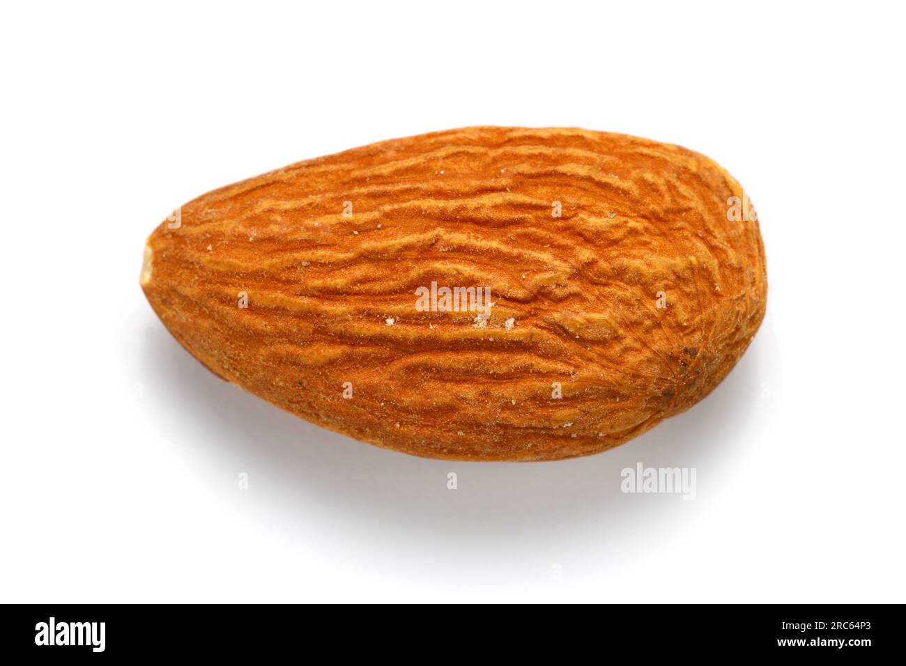 Almond nut on an White background. Raw almond. Close-up Stock Photo - Alamy