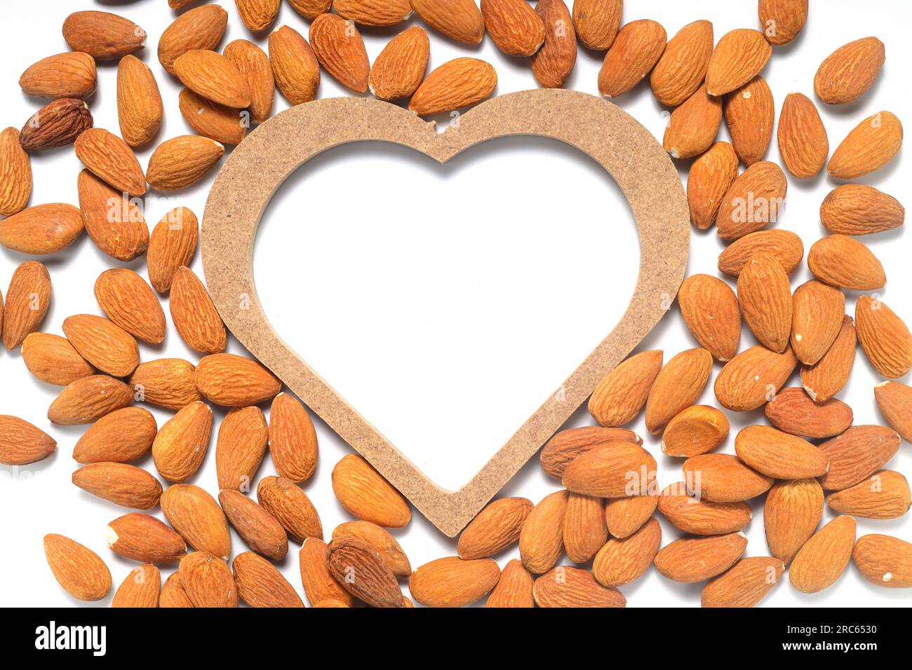 Almond heart on a white background. I love almonds. Healthy snack with ...