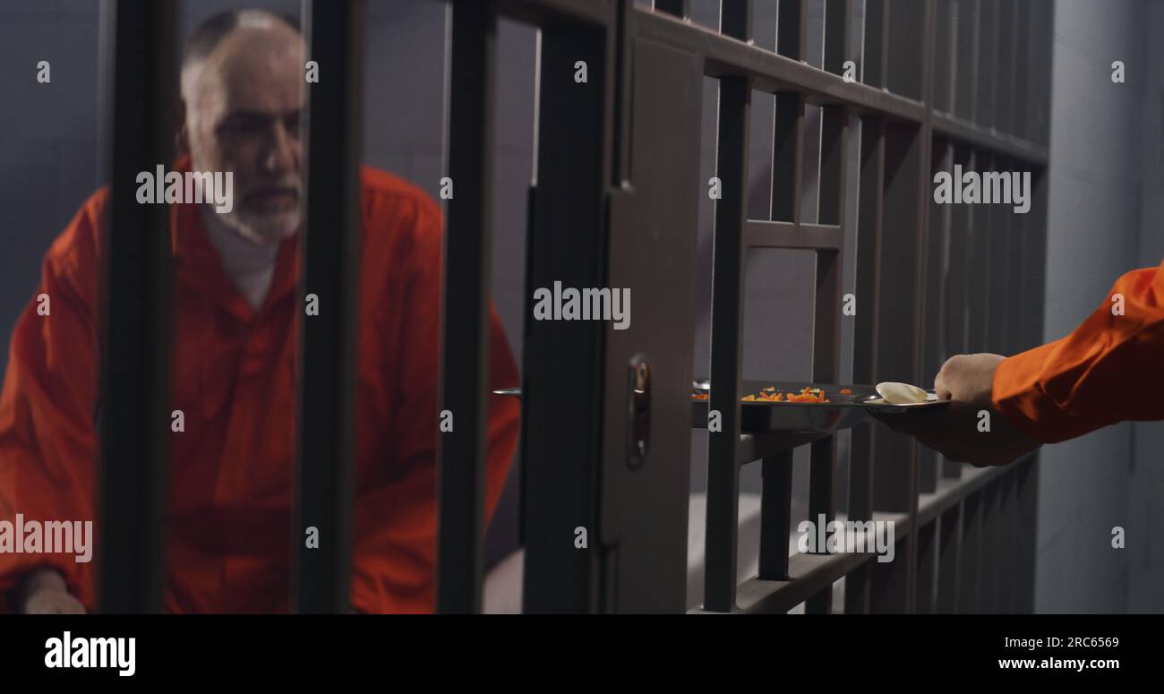 Man sits in jail cell hi-res stock photography and images - Alamy