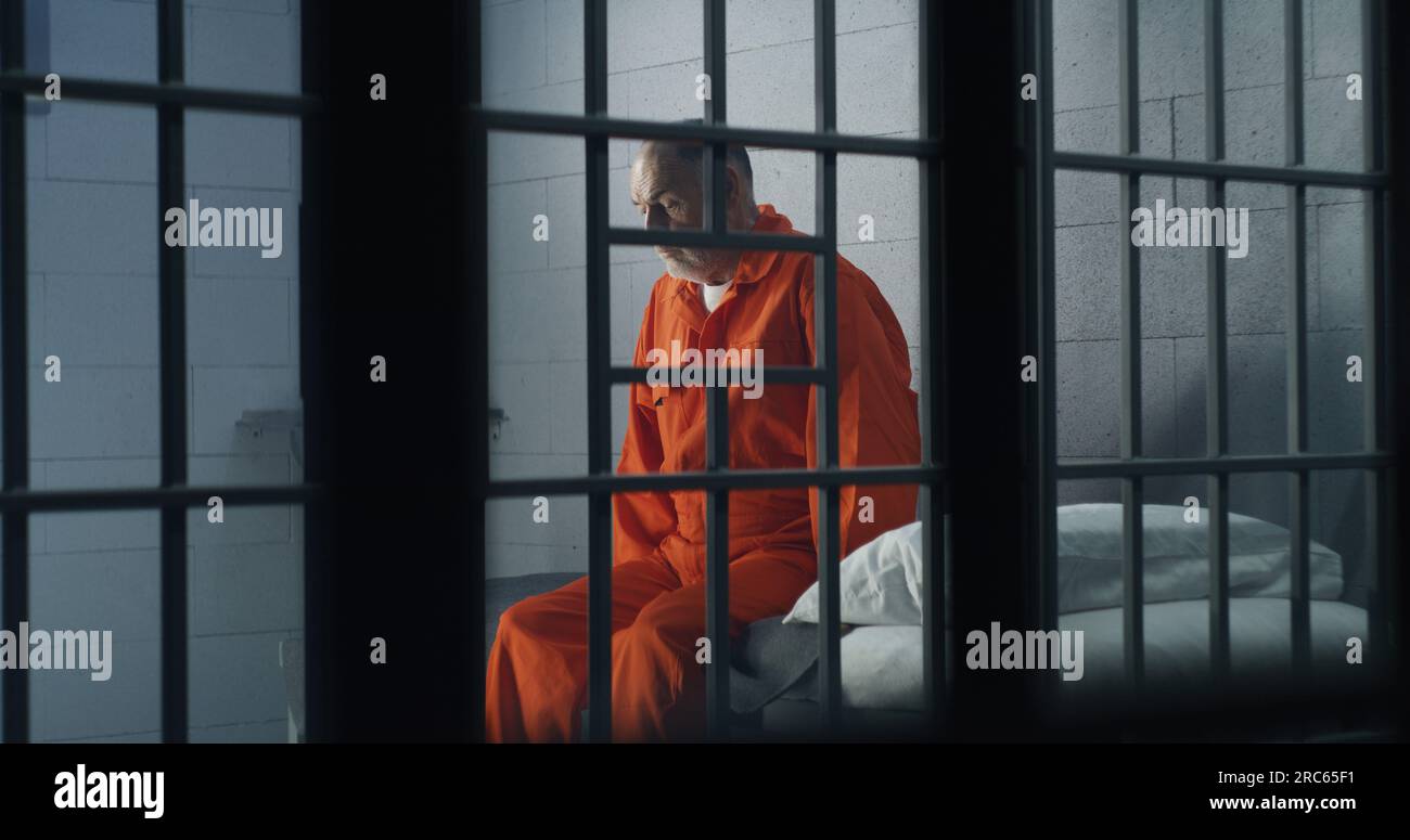 Man sits in jail cell hi-res stock photography and images - Alamy