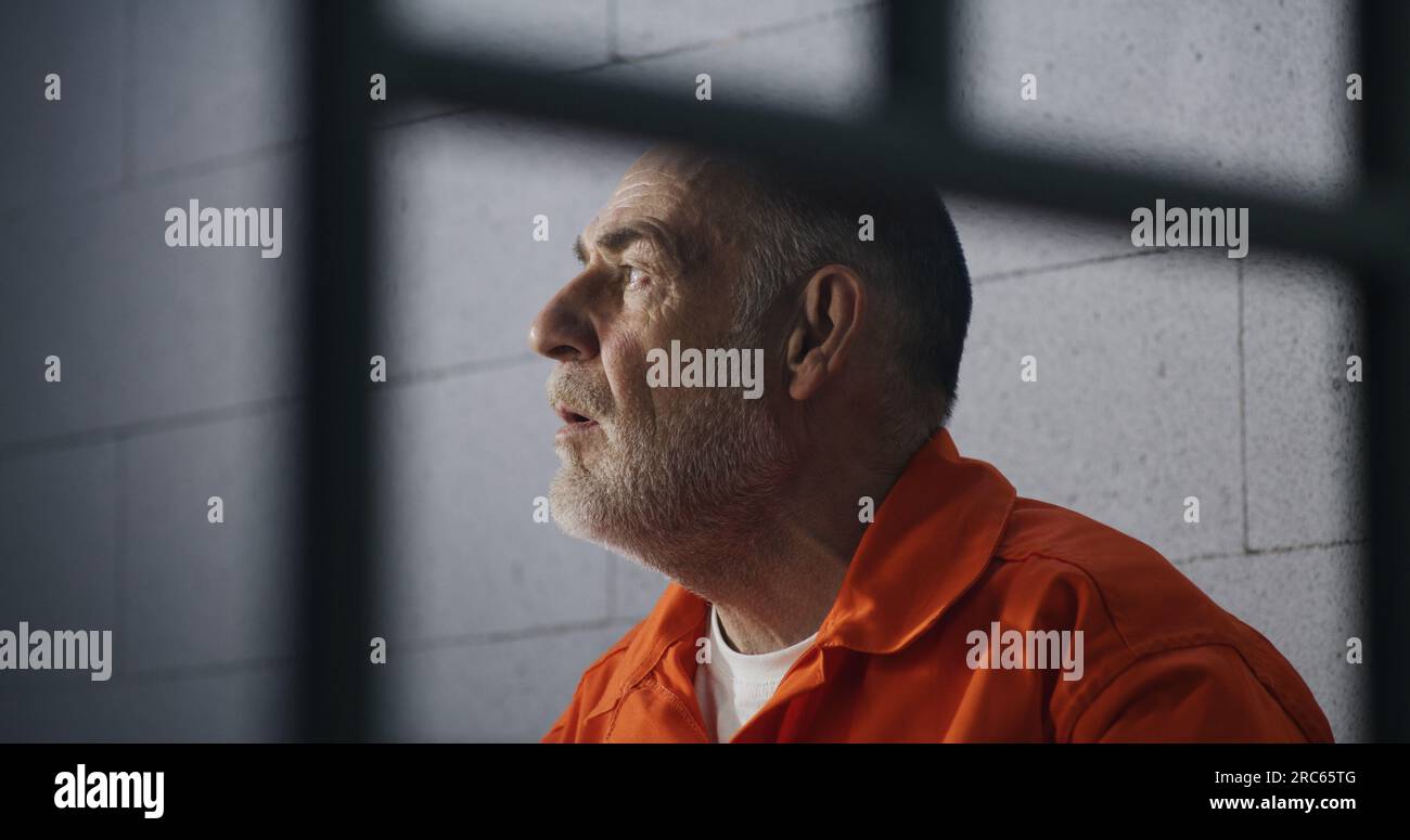 Man sits in jail cell hi-res stock photography and images - Alamy