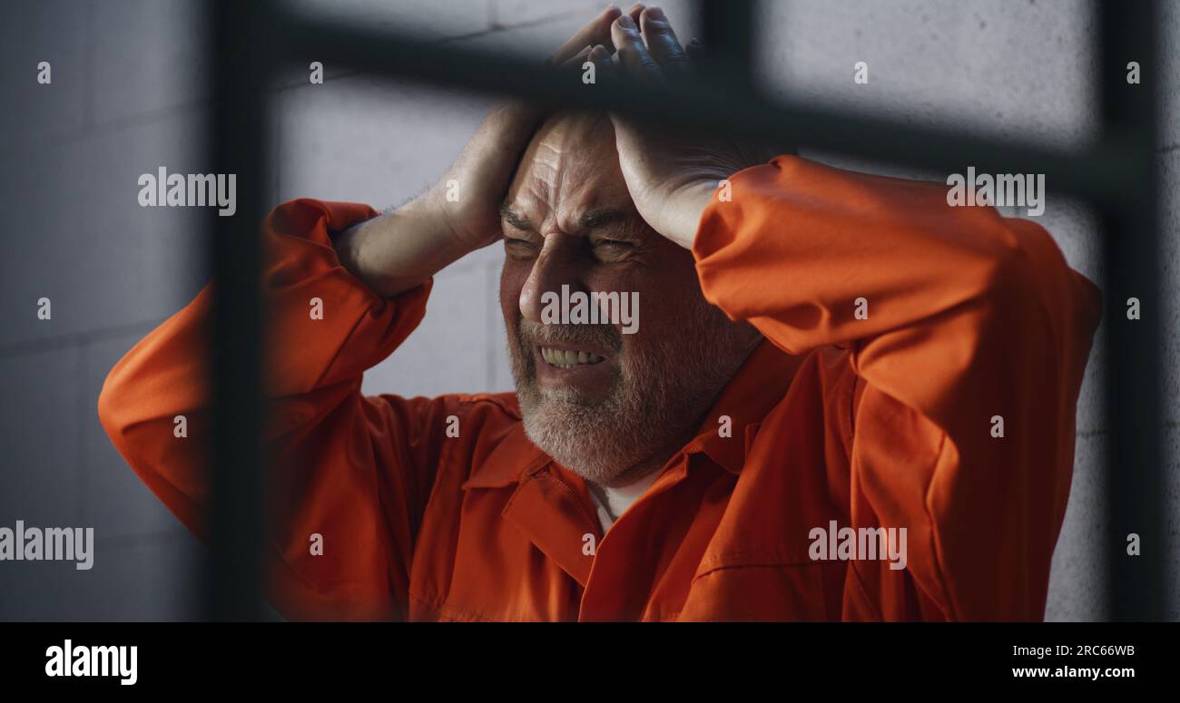Man sits in jail cell hi-res stock photography and images - Alamy