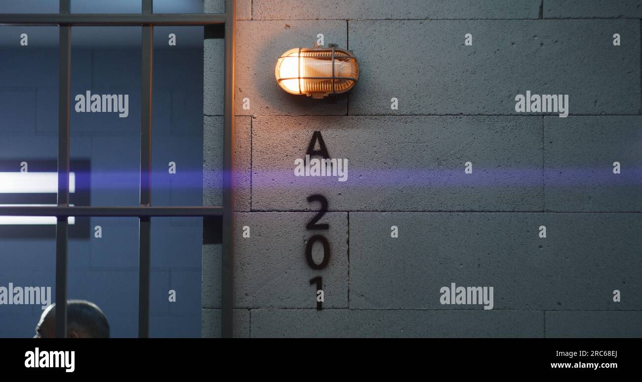 Man sits in jail cell hi-res stock photography and images - Alamy