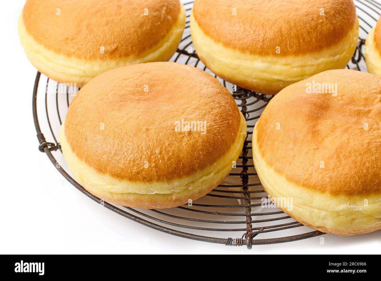 freshly baked jelly donuts closeup on white background Stock Photo - Alamy