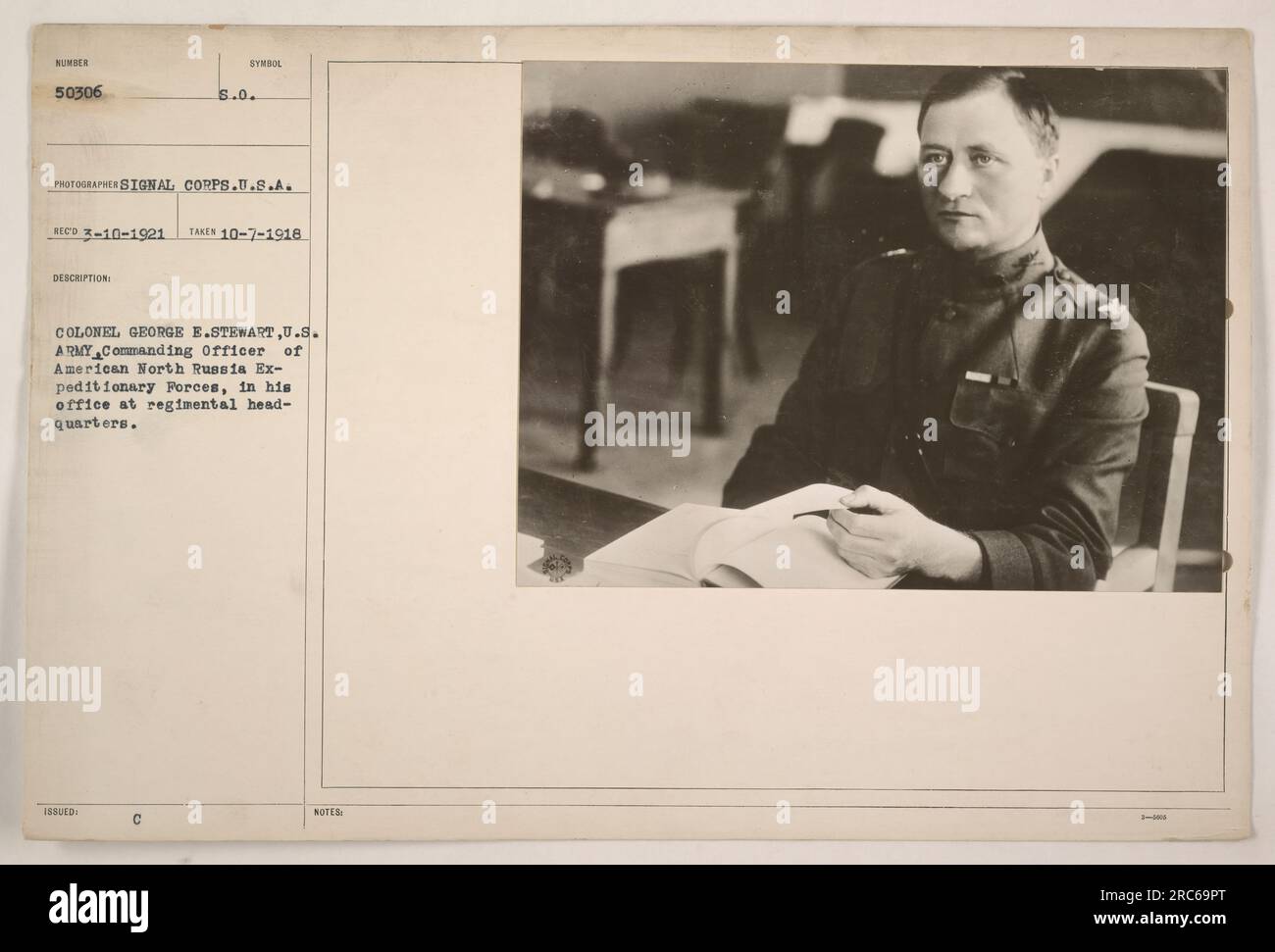 Colonel George E. Stewart, U.S. Army, is seen in his office at ...