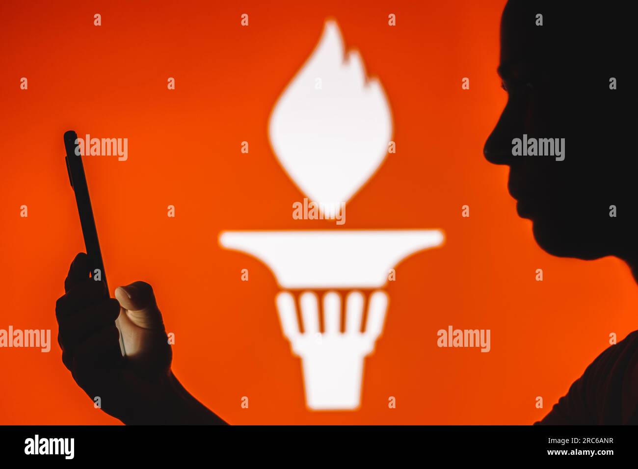 In this photo illustration, a person holds a smartphone with the Gettr ...