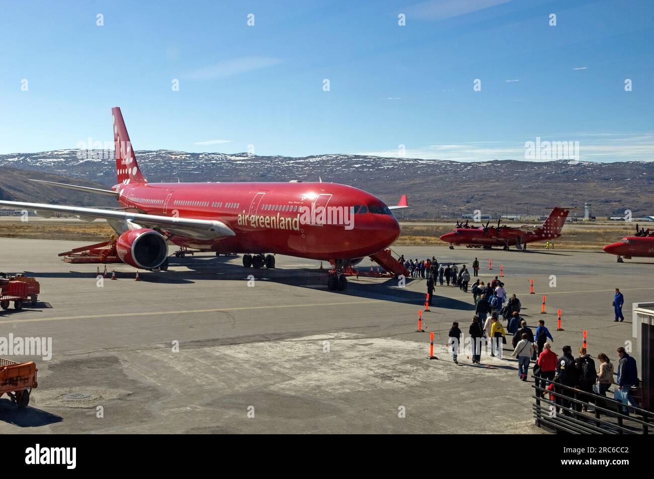 Passengers boarding an Air Greenland plane at Kangerlussuaq Airport in ...