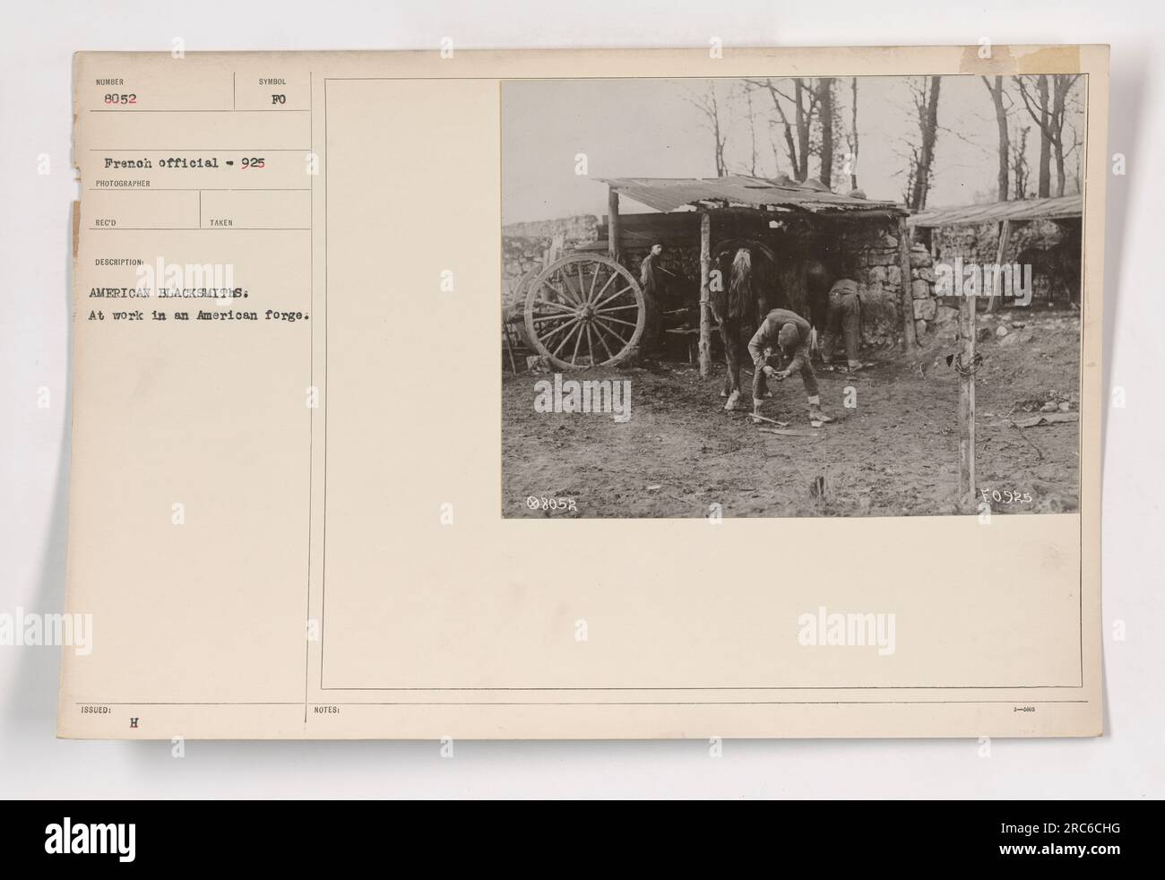 American blacksmiths working in a forge during World War One. This ...