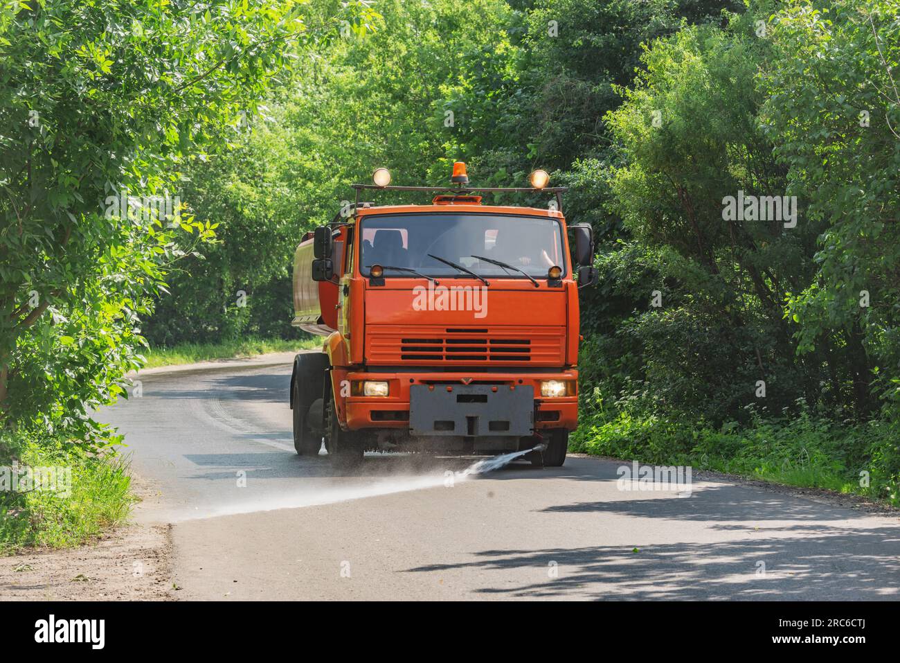 Cleaning machine washes the city street early in the morning Stock ...