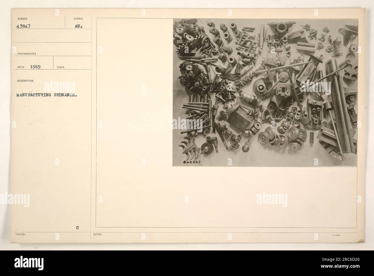 Soldier posing with an issued symbol of the American manufacturing ...