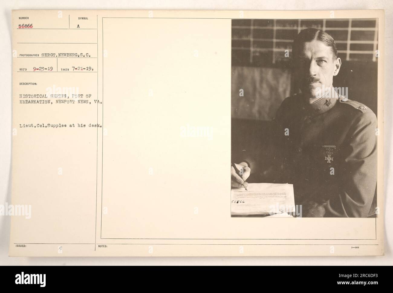 Lieutenant Colonel Supplee is seen at his desk in this photograph taken ...