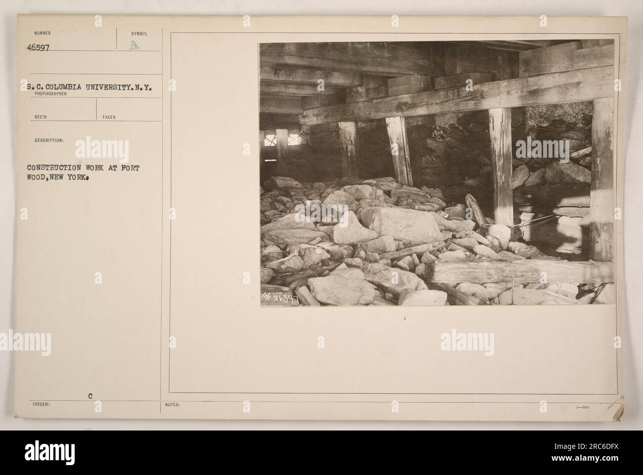 Construction workers can be seen working on the structures at Fort Wood ...