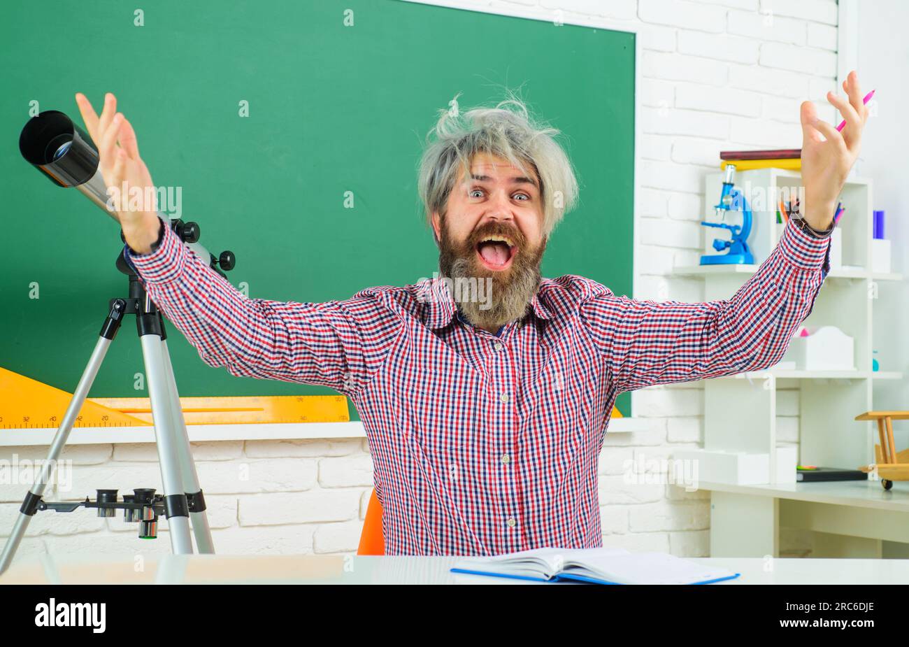 Excited professor teacher in classroom. Learning and education. Happy ...