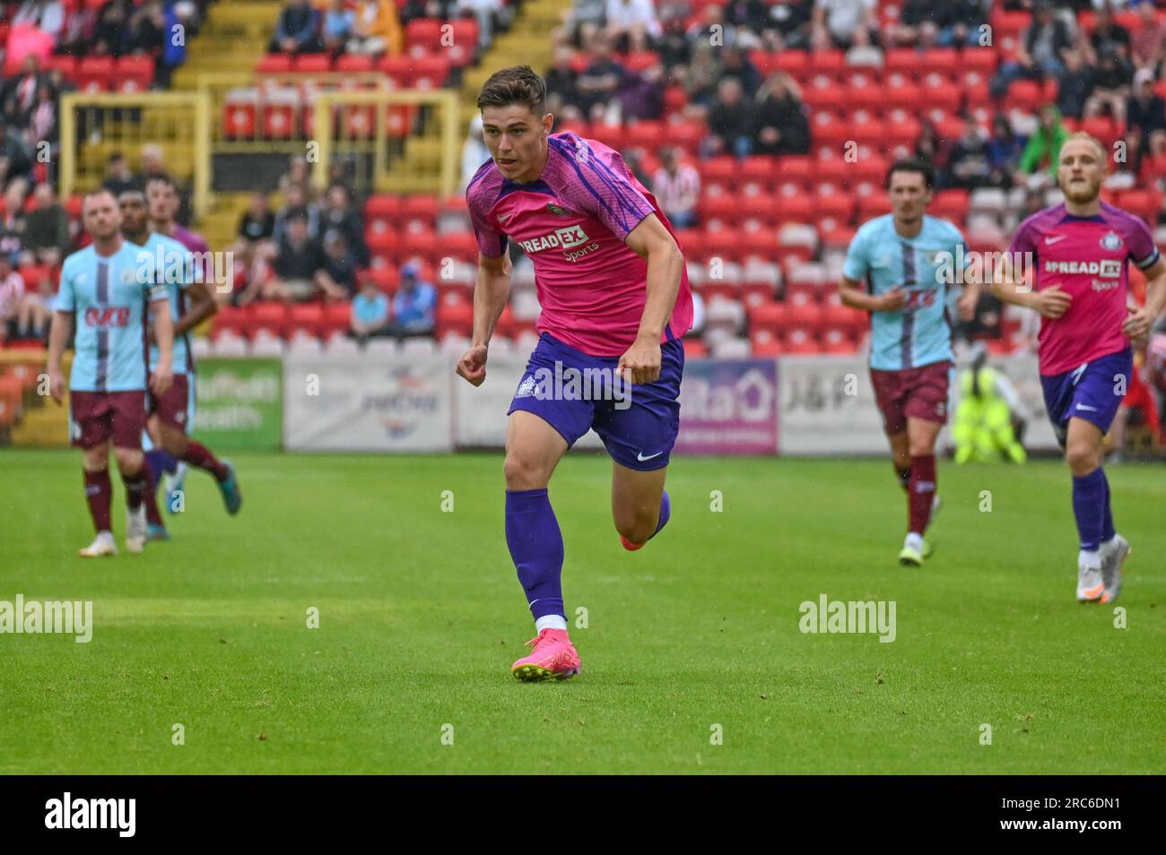 Sunderland AFC's Max Thompson puts pressure on the Gateshead defence ...