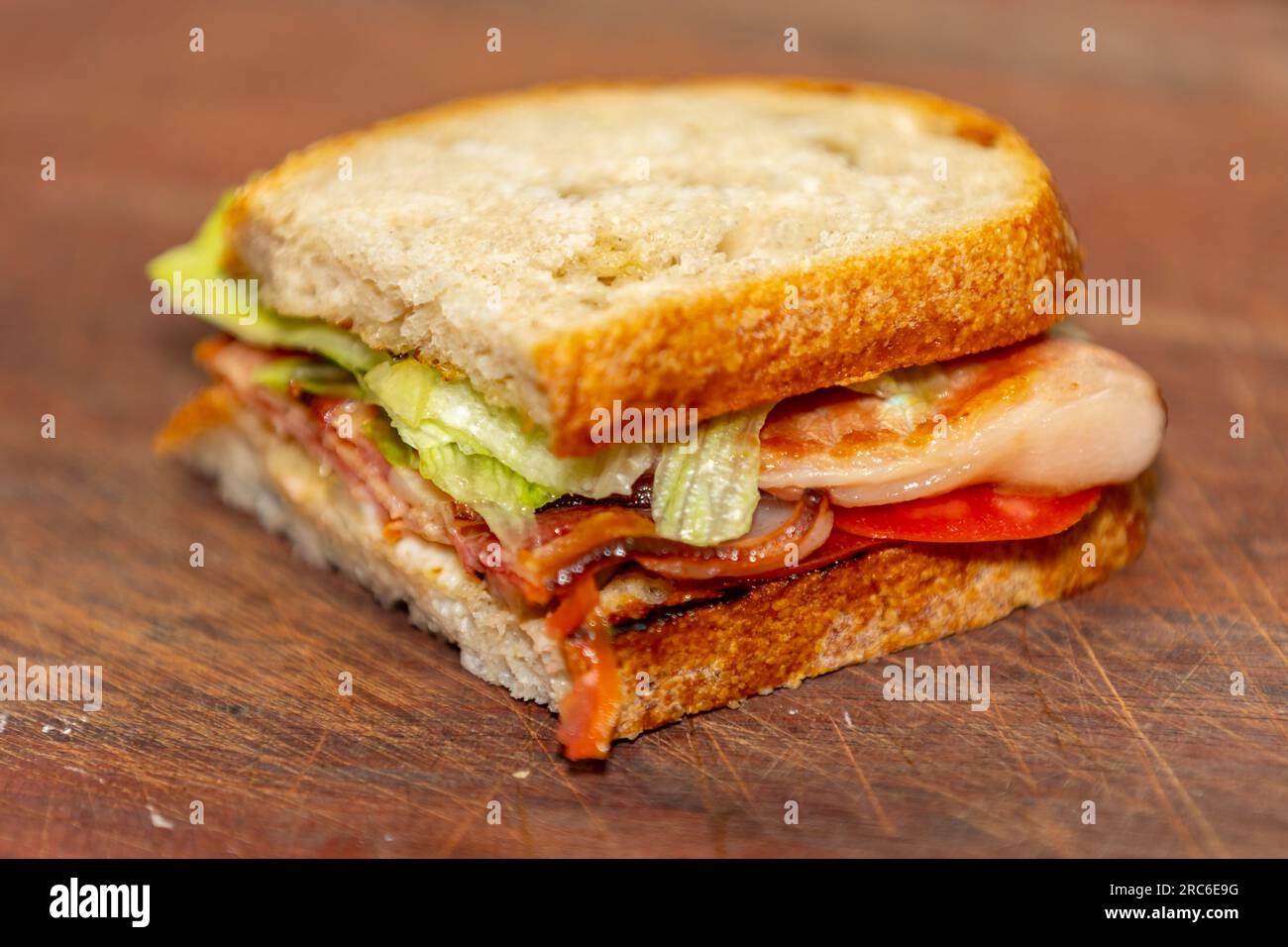 Traditional rustic sandwich with bacon and salad Stock Photo - Alamy