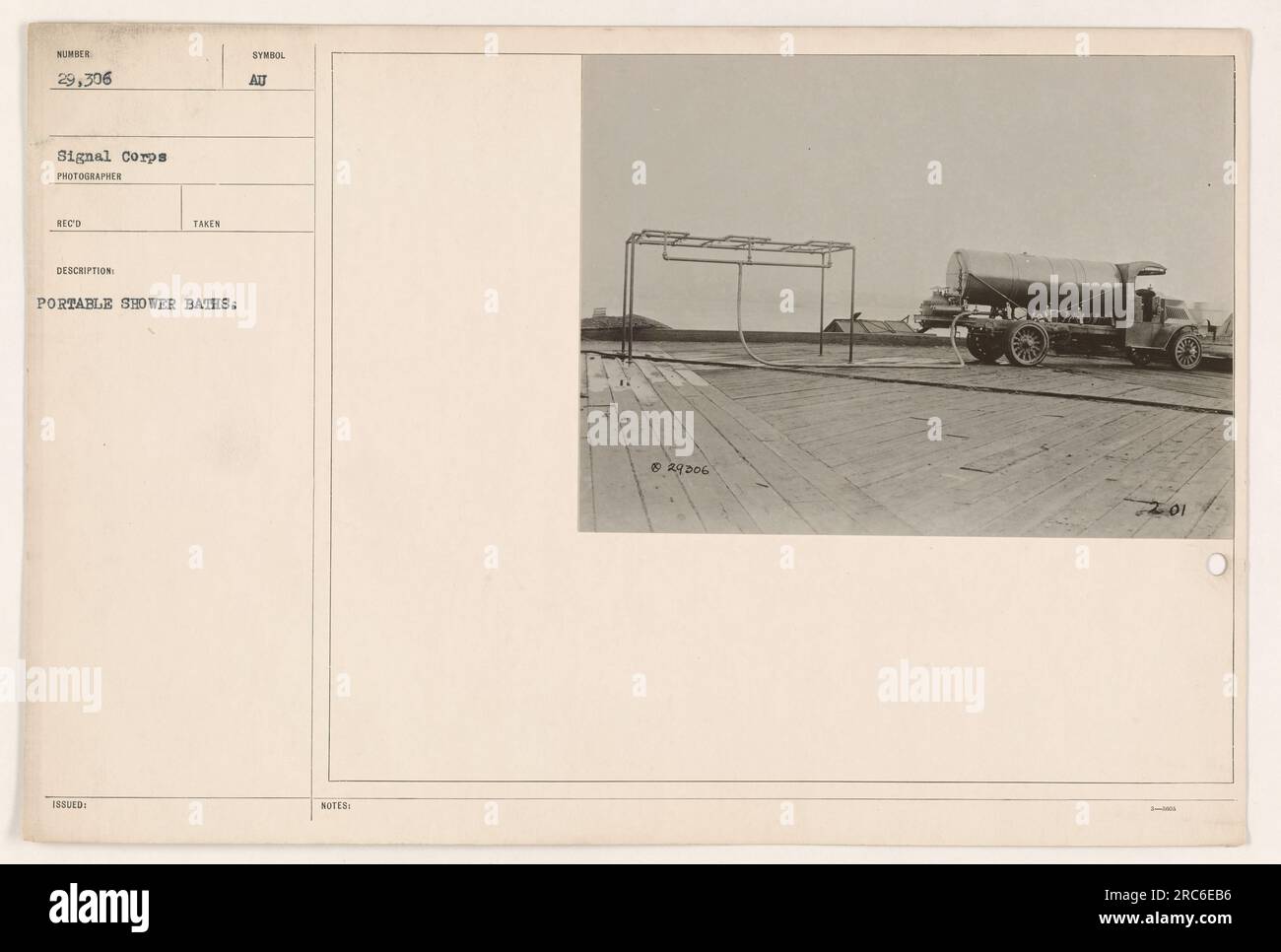 A group of soldiers can be seen using portable shower baths in this ...