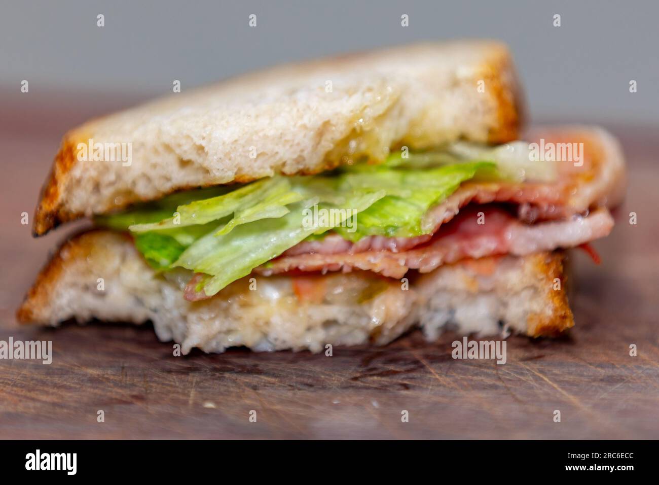 Traditional rustic sandwich with bacon and salad Stock Photo - Alamy