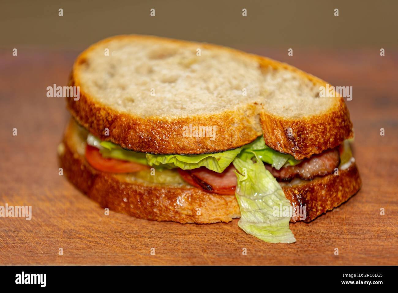 Traditional rustic sandwich with bacon and salad Stock Photo - Alamy