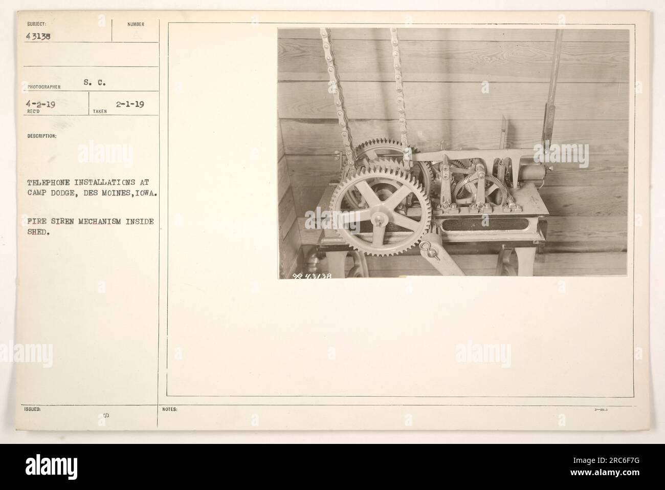 Soldiers are seen installing telephone lines at Camp Dodge in Des ...