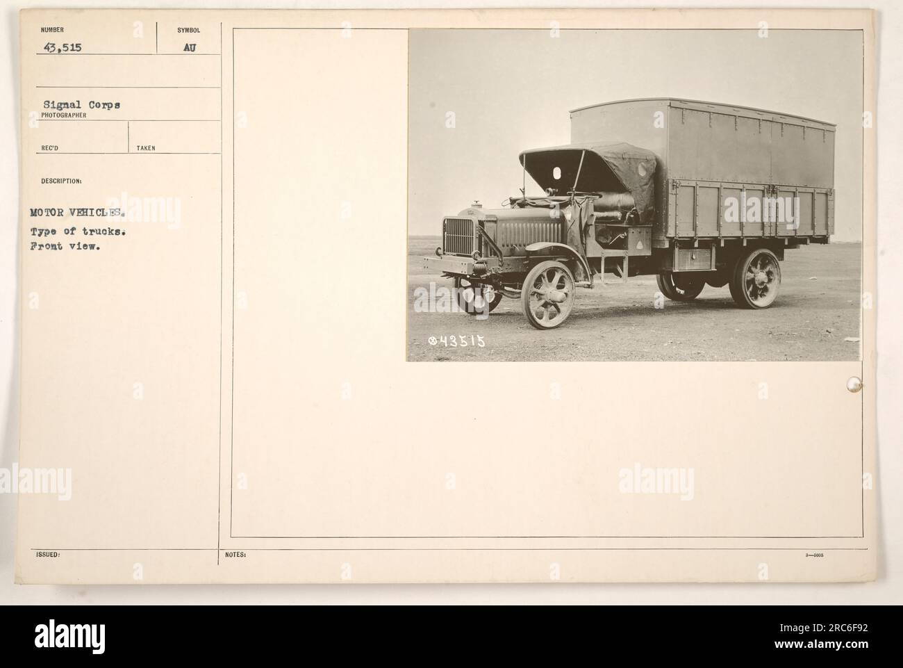 A front-view photograph depicting various military motor vehicles ...