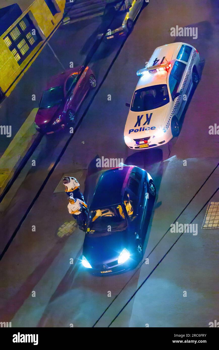 NSW Police conduct a night-time traffic stop on Liverpool Street near ...