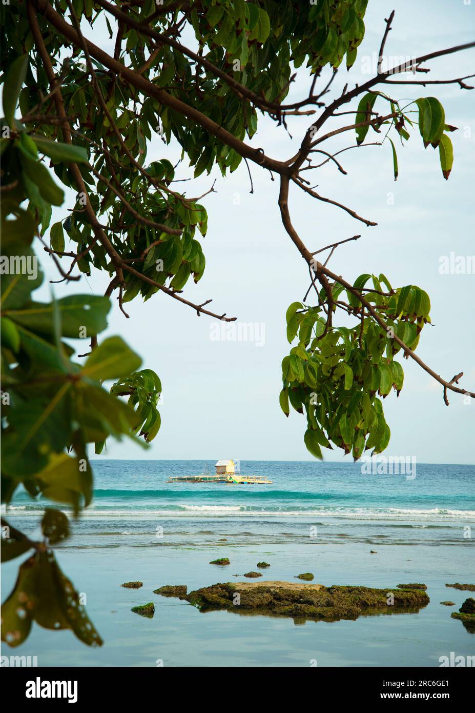 Supported by empty oil cans,used as floats,the makeshift hut provides ...