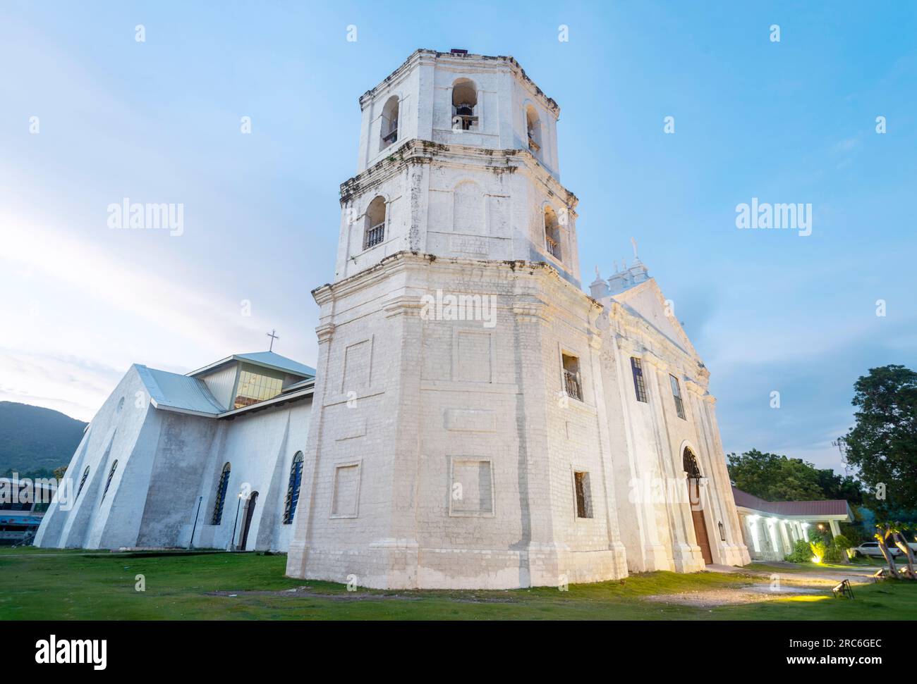 Exterior view of Oslob Church,illuminated as night approaches,by ...
