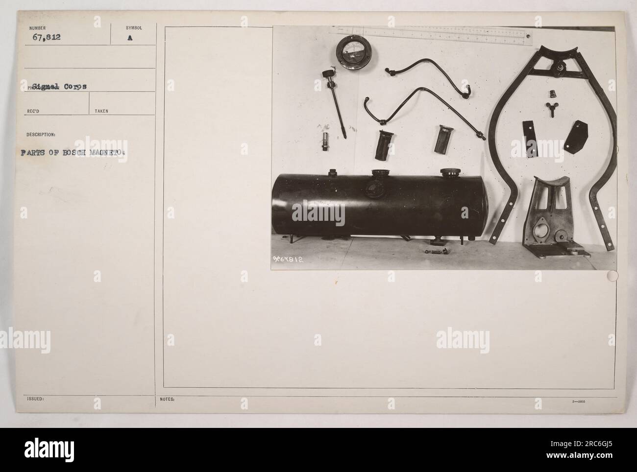 Image of a soldier working on a Bosch magneto during World War I. The ...
