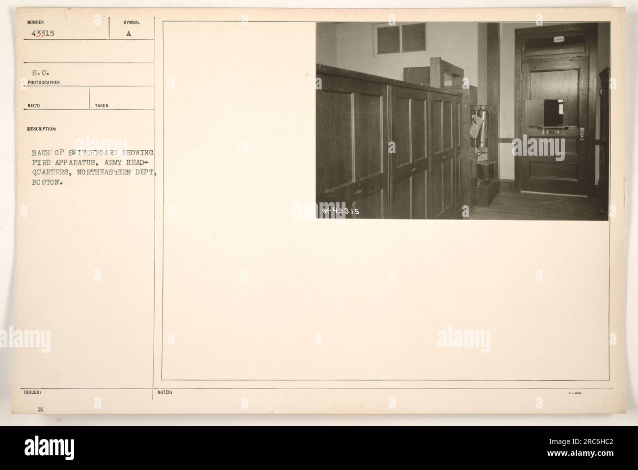 Photograph 111-SC-43315 captures the back of a switchboard exhibiting ...