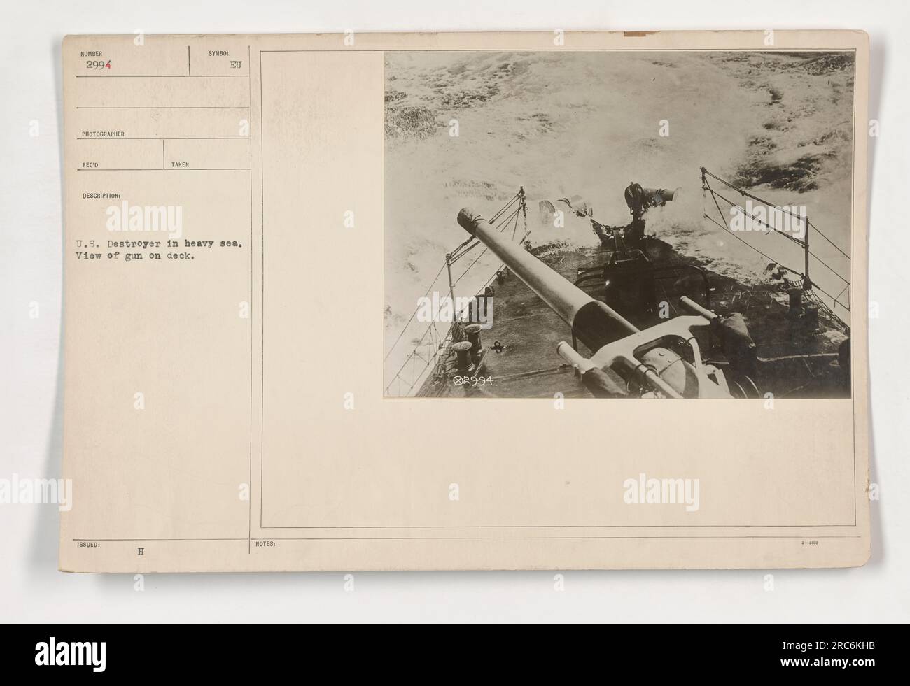 U.S. Destroyer navigating rough seas, with a clear view of a gun on the ...