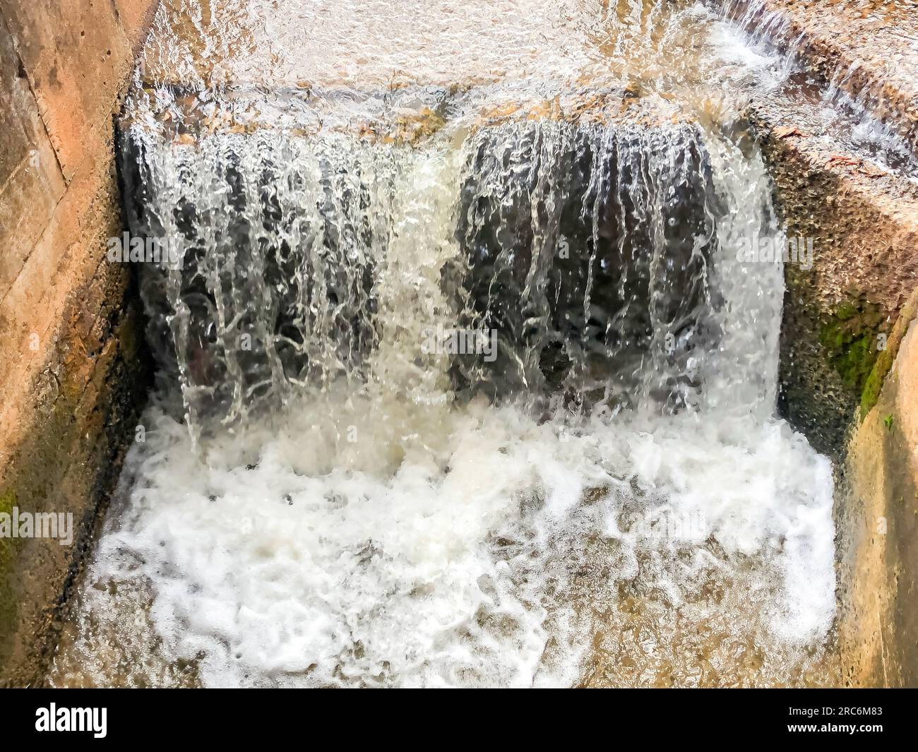 Small waterfall showing water texture in splashes Stock Photo - Alamy