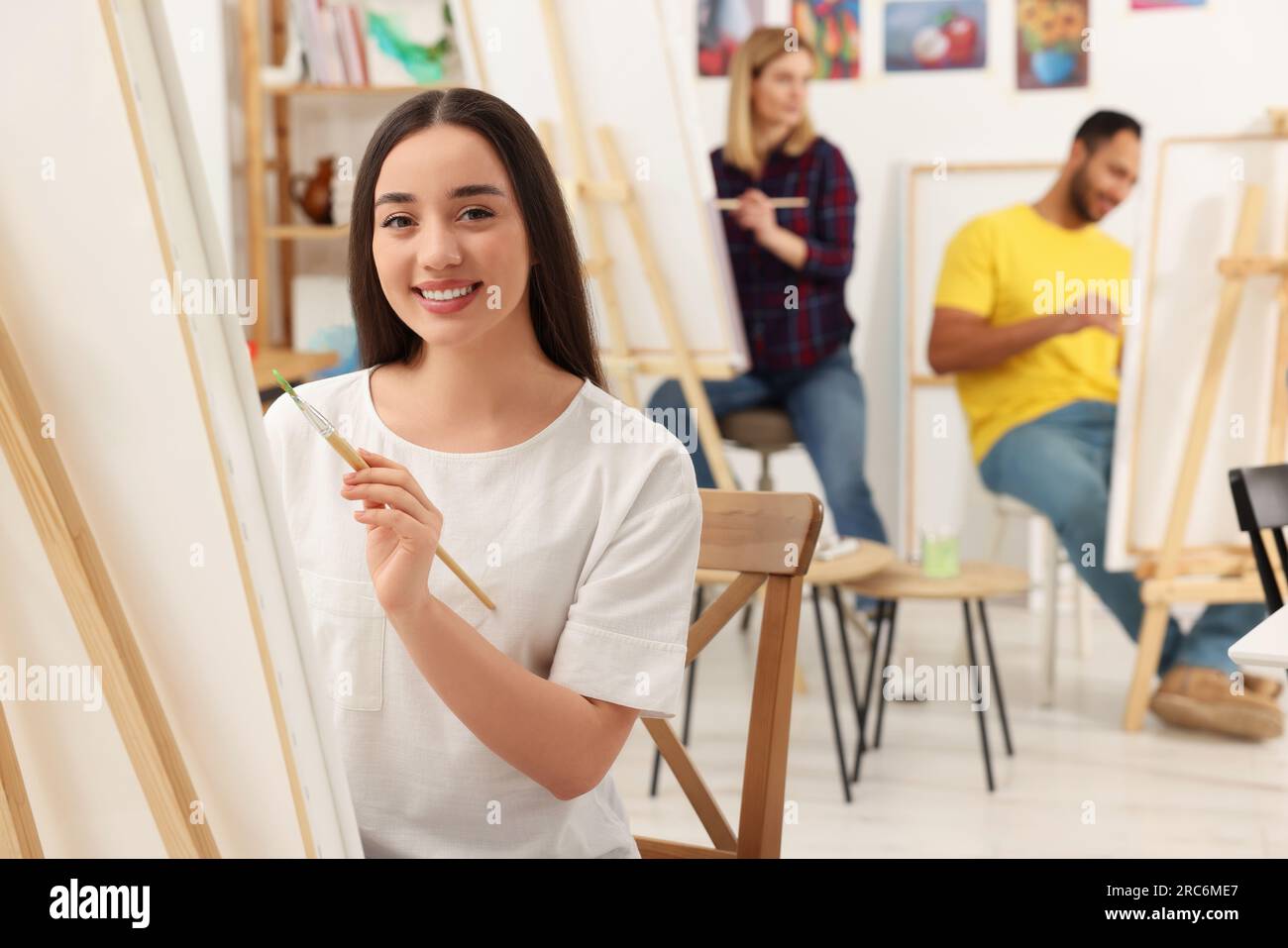 Group of students attending painting class in studio. Creative hobby ...