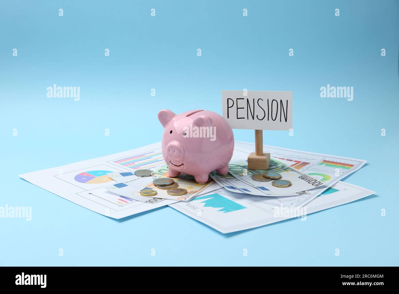 Pension savings. Piggy bank, cash and graphs on light blue background ...