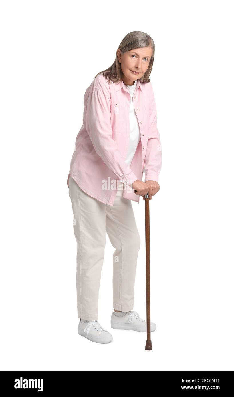 Senior woman with walking cane on white background Stock Photo - Alamy
