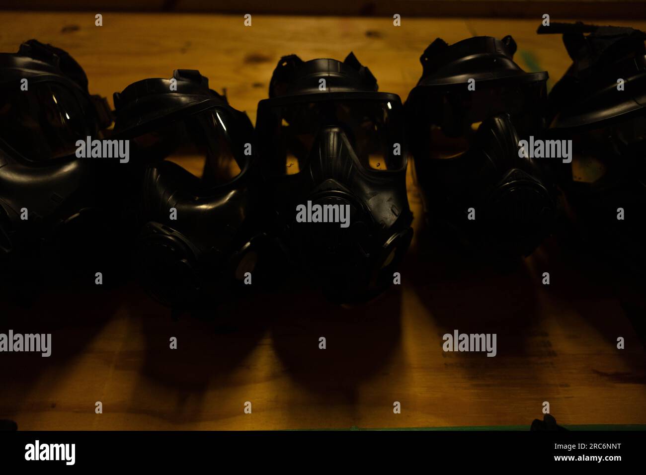 M50 gas masks rest on a wall in preparation to be used for the Gas ...