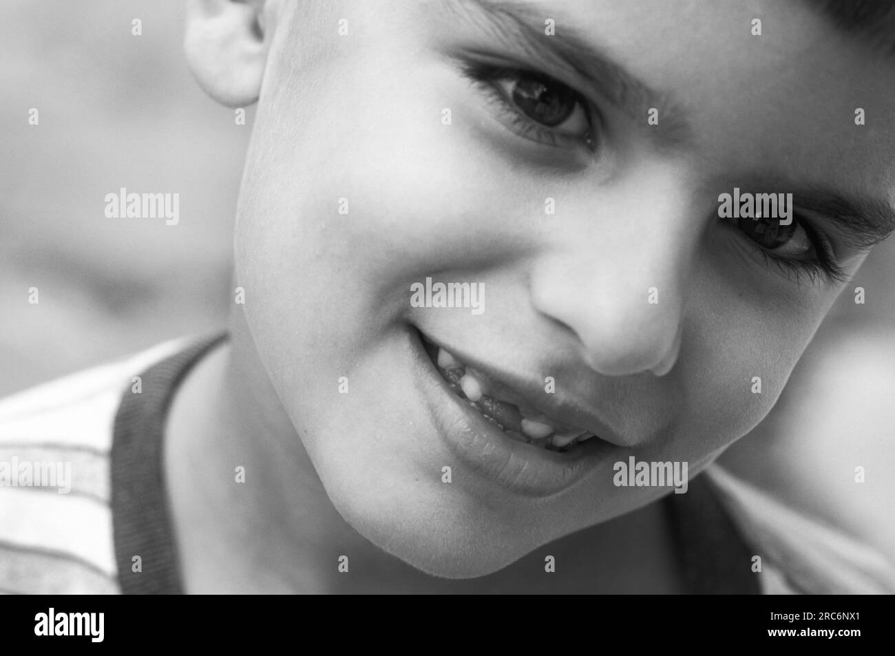 Boy with a toothless smile Stock Photo - Alamy