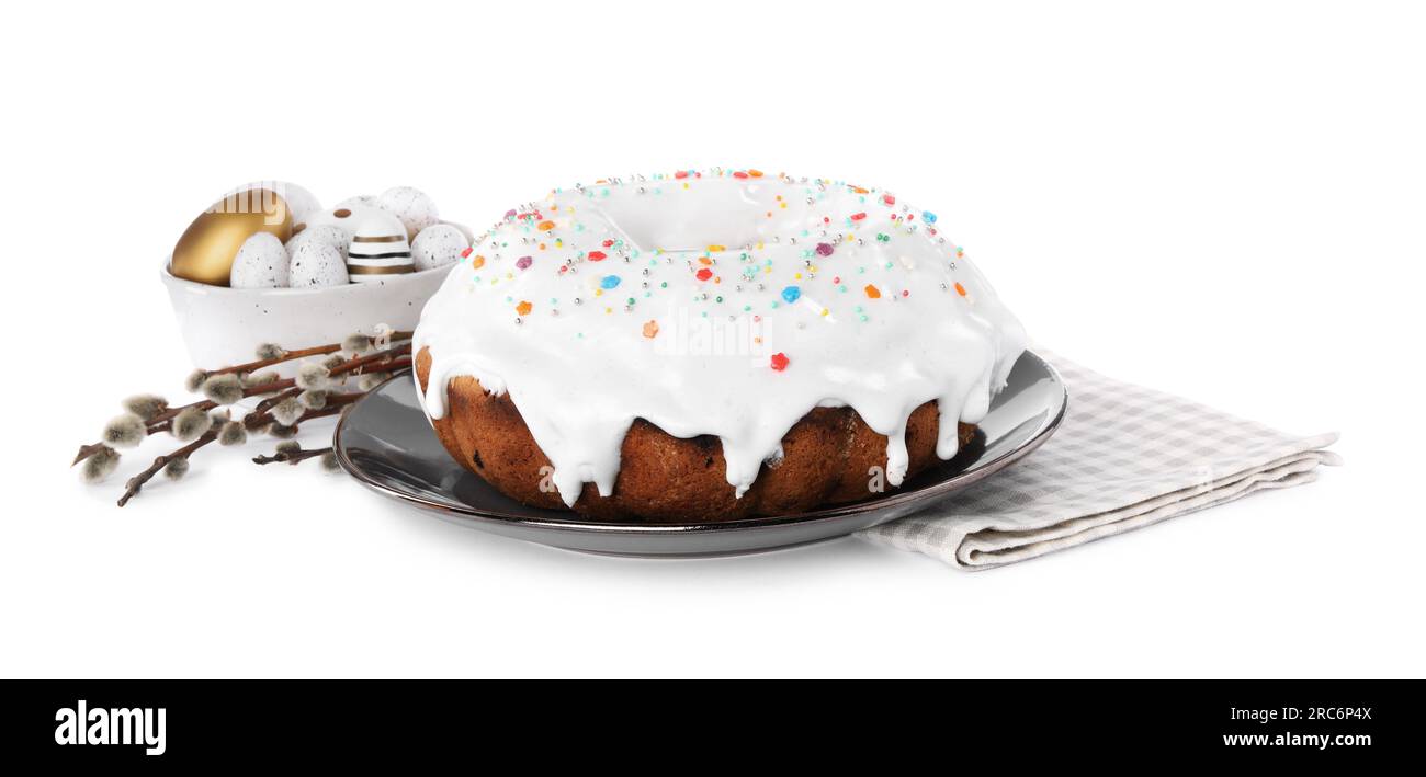Easter cake with sprinkles, painted eggs and willow branches isolated ...