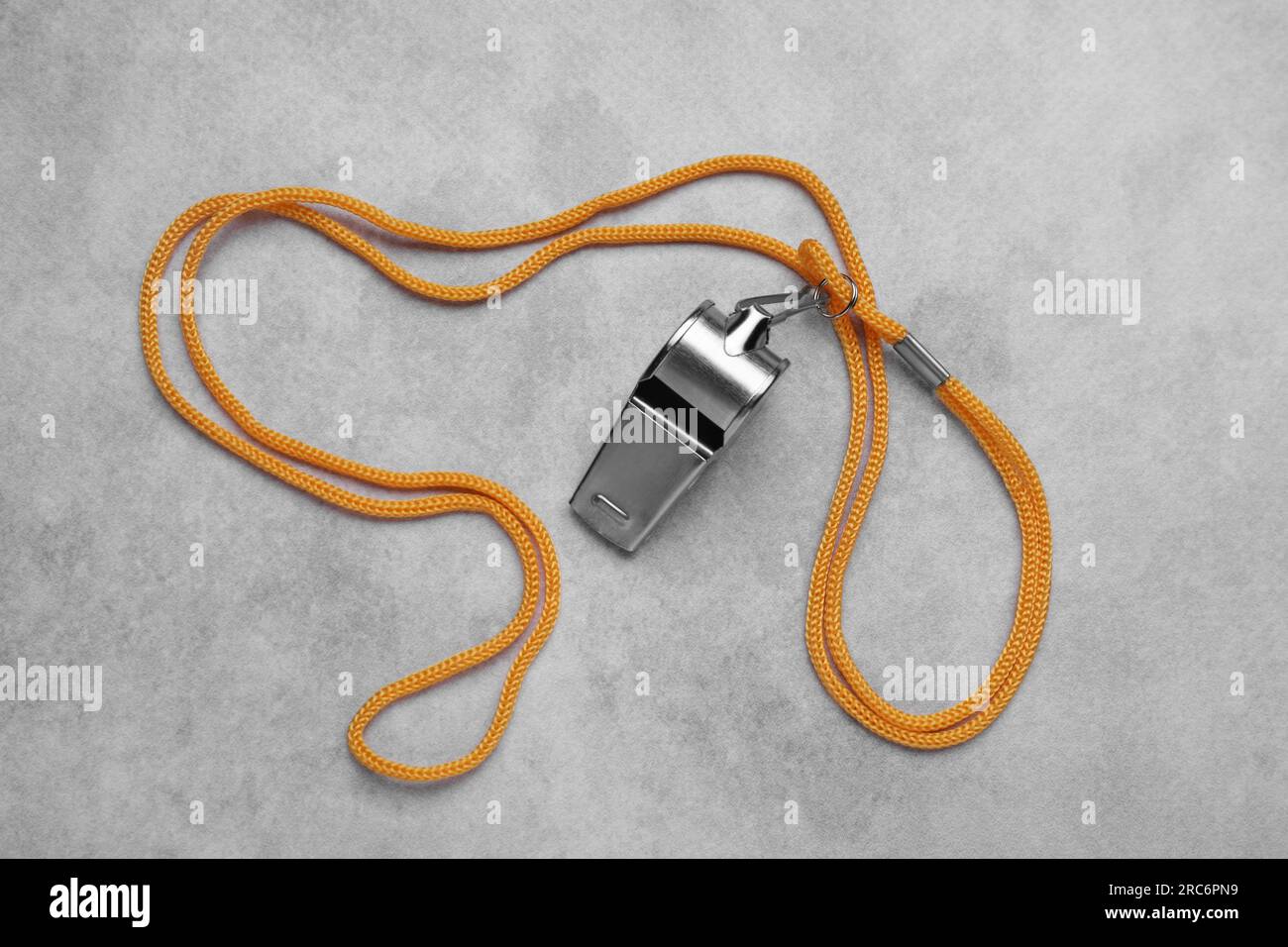 One metal whistle with cord on light grey table, top view Stock Photo ...