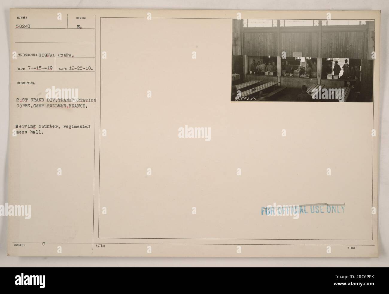 Soldiers lining up to receive their meals at the serving counter in the ...