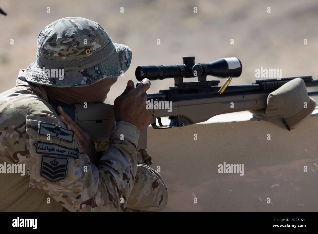 A member of the Jordanian Armed Forces conducts sniper training during ...